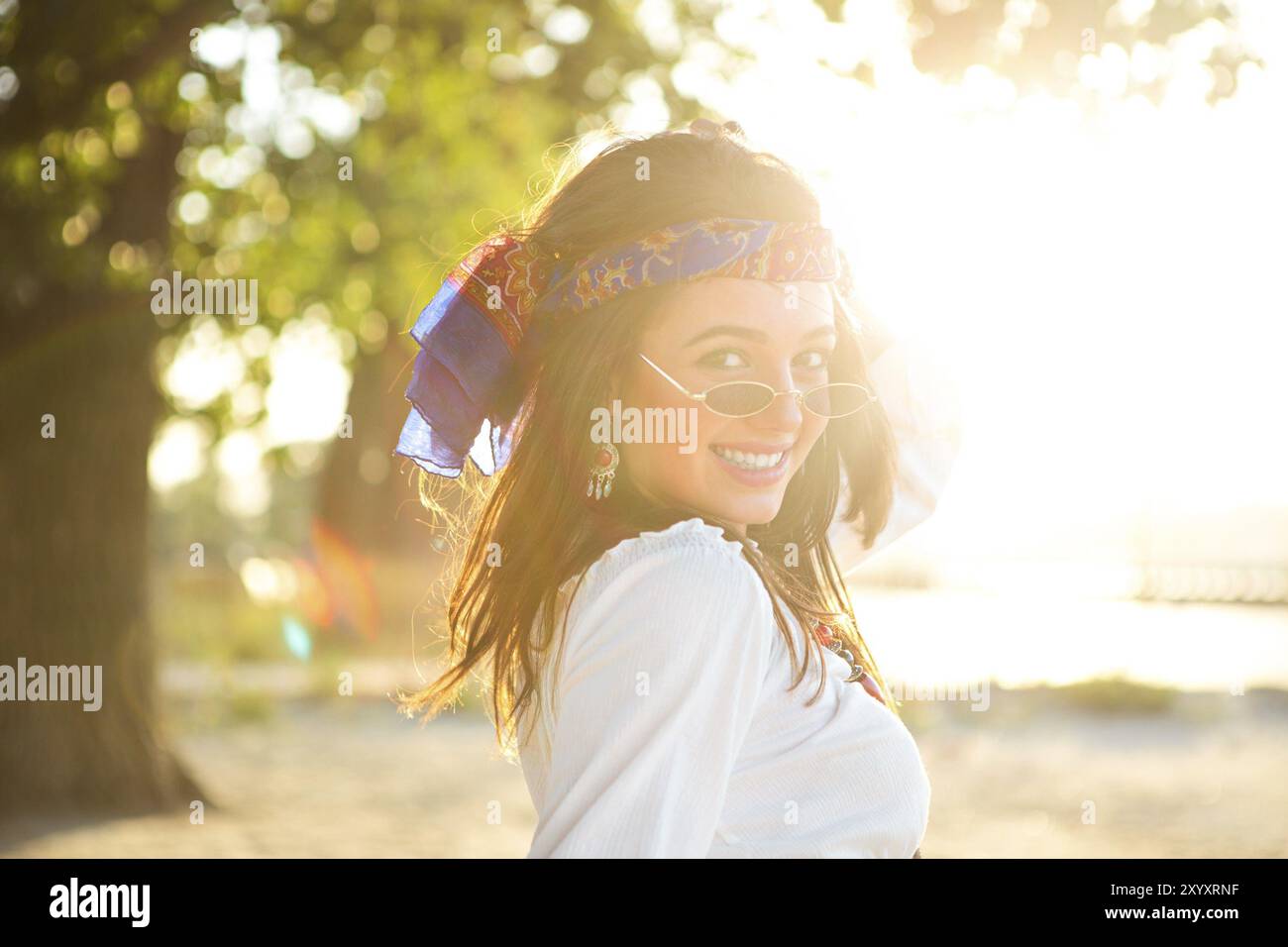 Happy slim tan woman in jeans dancing on the beach in sunset Stock ...