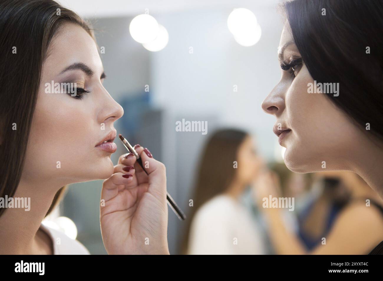 Close up professional artist applying hi-res stock photography and ...