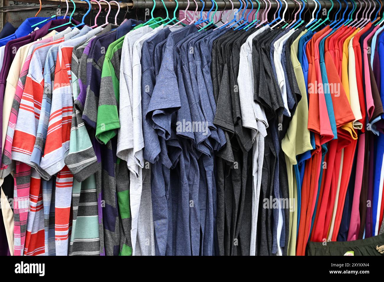 selling colorful T shirts in Kerala India Stock Photo - Alamy