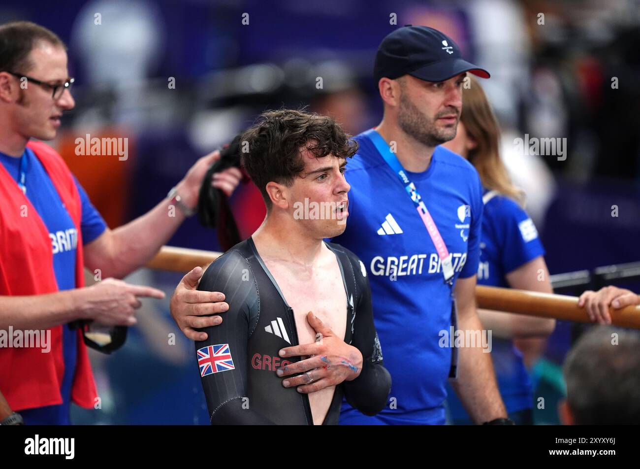 Great Britain's Archie Atkinson helped up after crashing during the Men ...