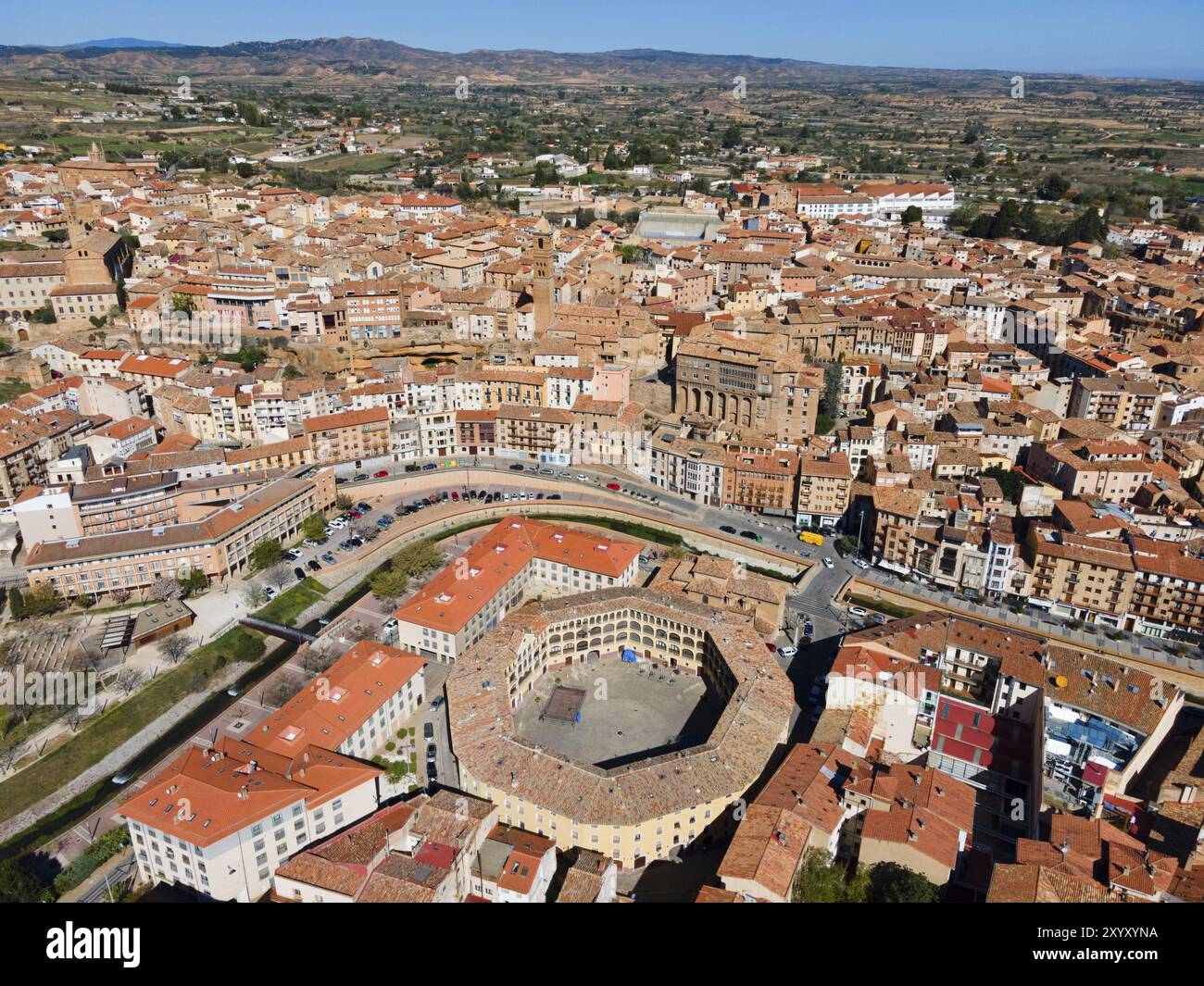 Aerial view of a historic town with tiled roofs and a central square in ...