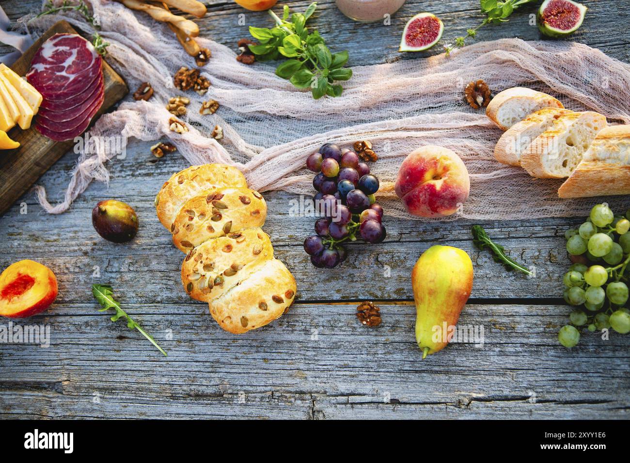 Picnic on the beach at sunset in boho style. Romantic dinner, friends ...