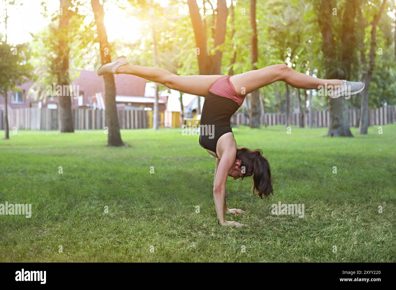 Stretching woman in outdoor exercise smiling happy doing stretches ...