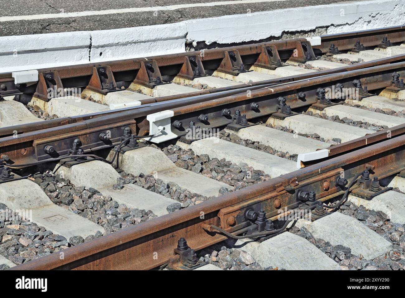 Arrow Rails. Rail and concrete sleepers closeup Stock Photo - Alamy