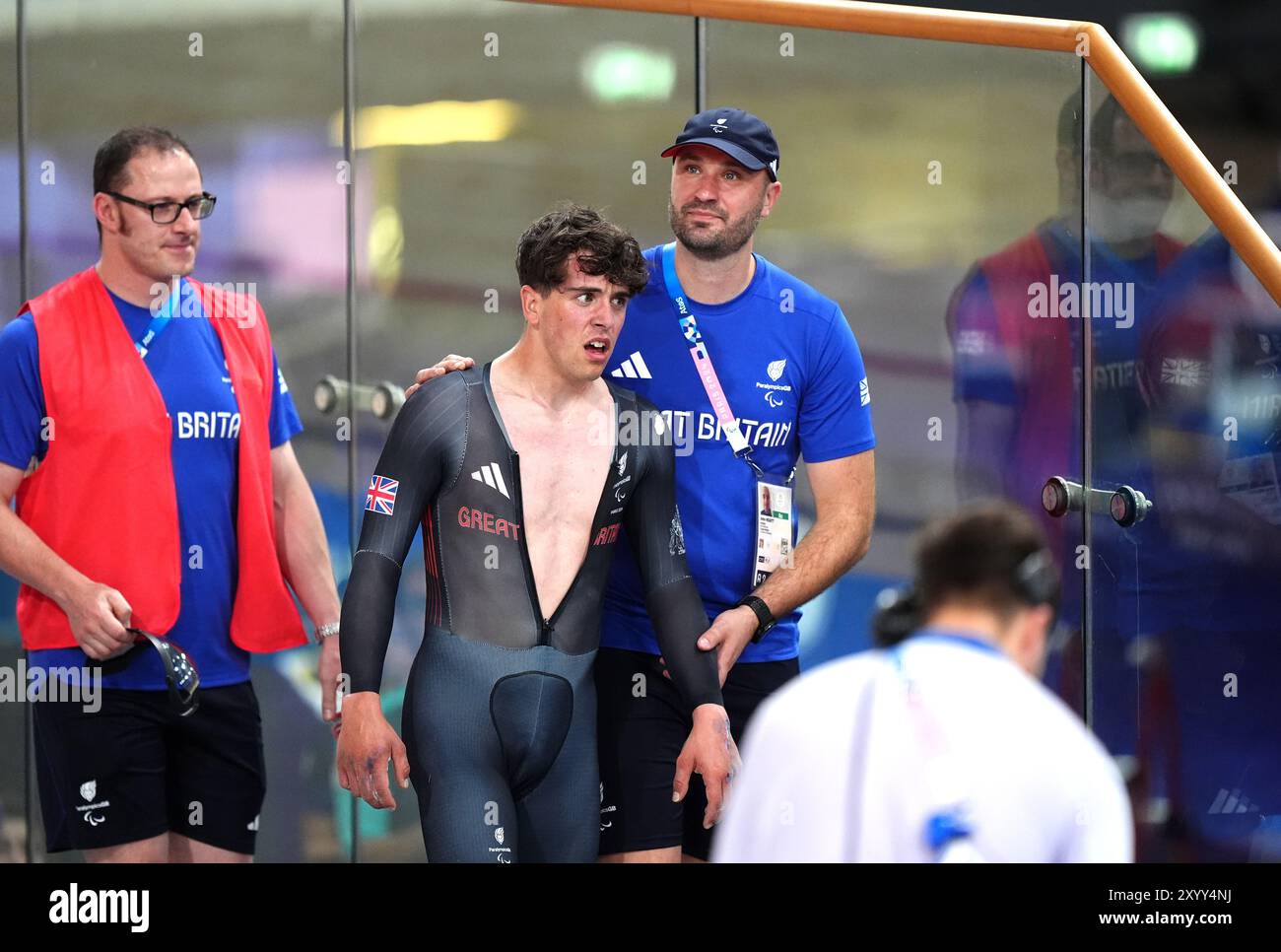 Great Britain's Archie Atkinson helped up after crashing during the Men ...