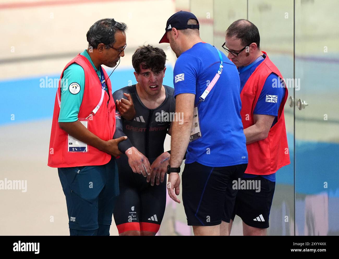 Great Britain's Archie Atkinson helped up after crashing during the Men ...