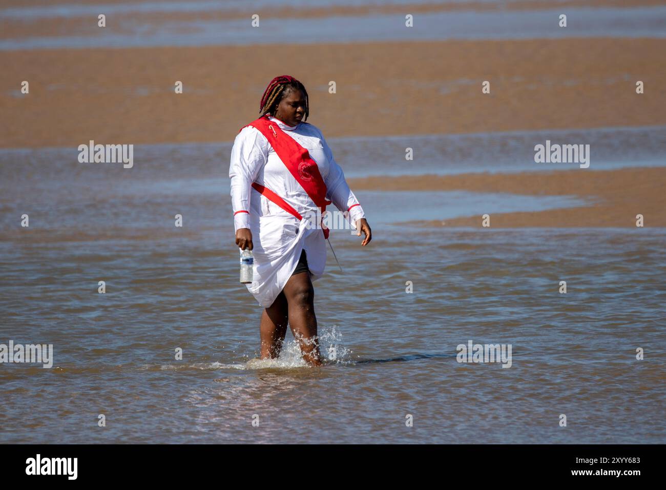 Jesus White Robe Biblical Red Sash ; Christian Group bathing in the sea ...