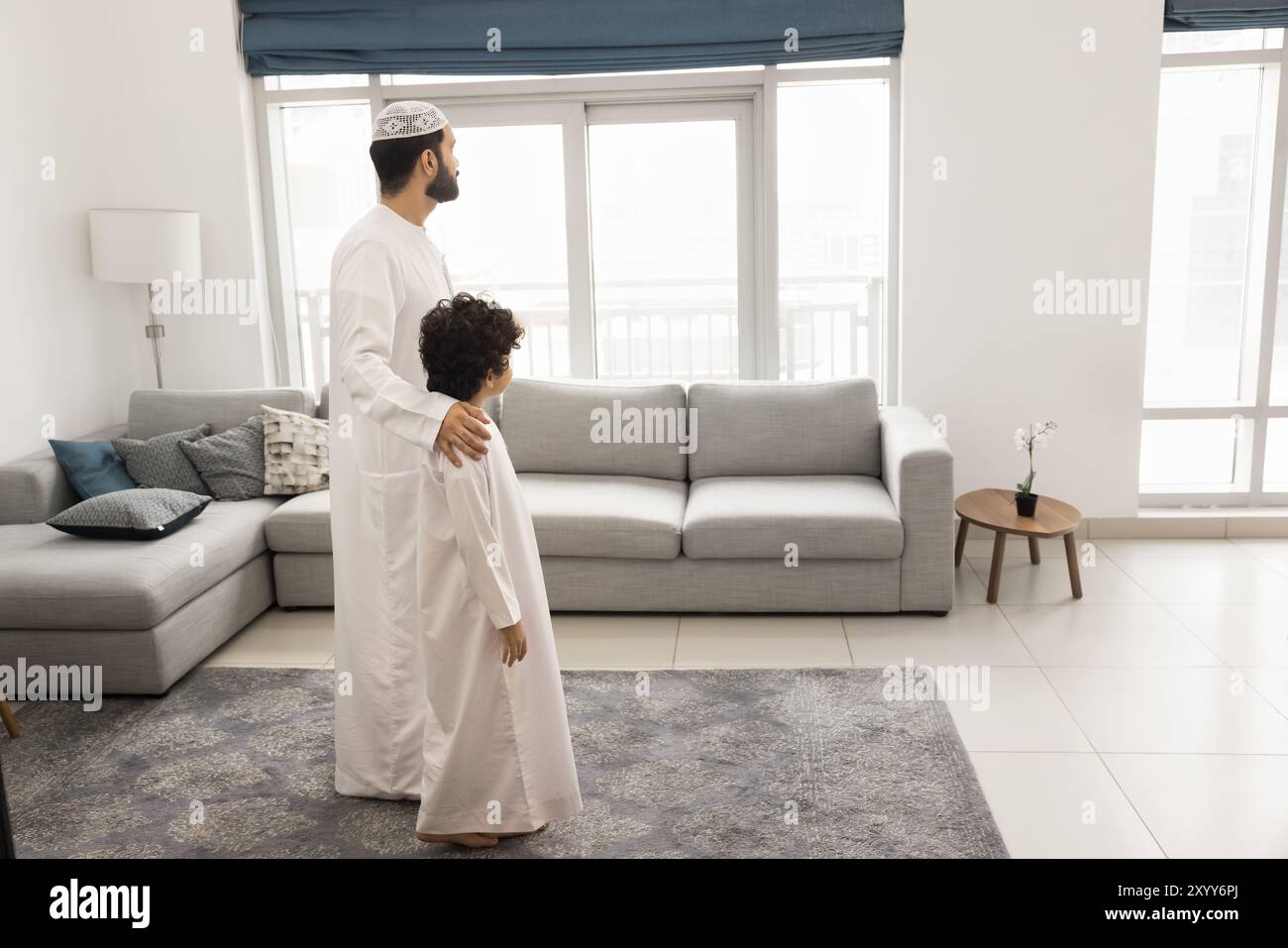 Middle Eastern Arab father and kid standing at home Stock Photo - Alamy