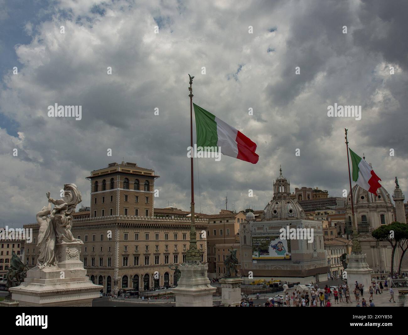 Two Italian flags fly over a city with magnificent monuments and ...
