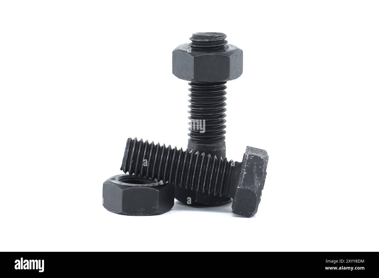 Black metal hexagonal bolts and nuts shown in close-up isolated on ...