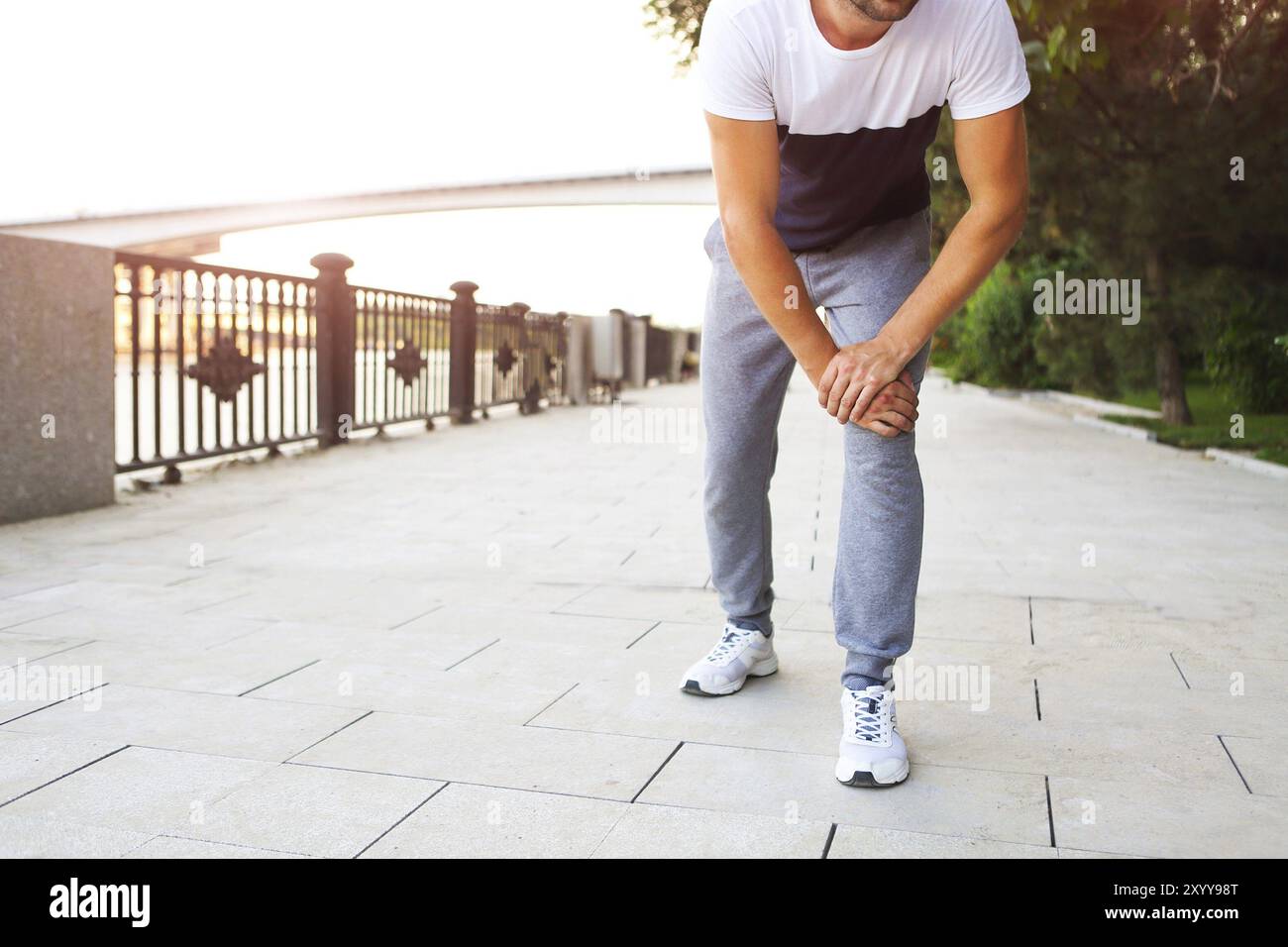 Running injury man hi-res stock photography and images - Alamy