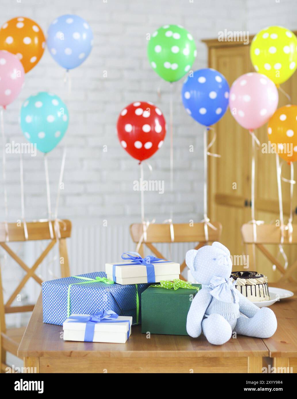 Baby shower. Sweets and presents on the table. Decorated with balloons ...