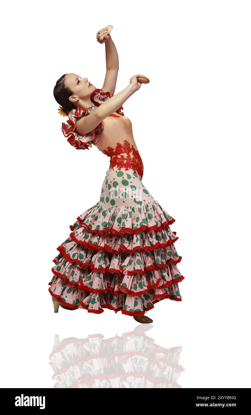 Young woman dancing flamenco with castanets on white background Stock ...