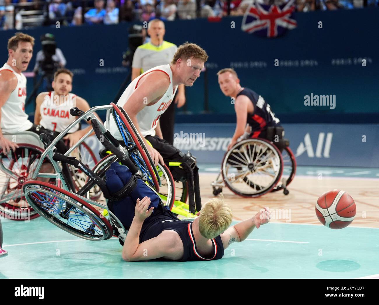Great Britain's Lee Fryer goes over watched by Canada's Patrick ...