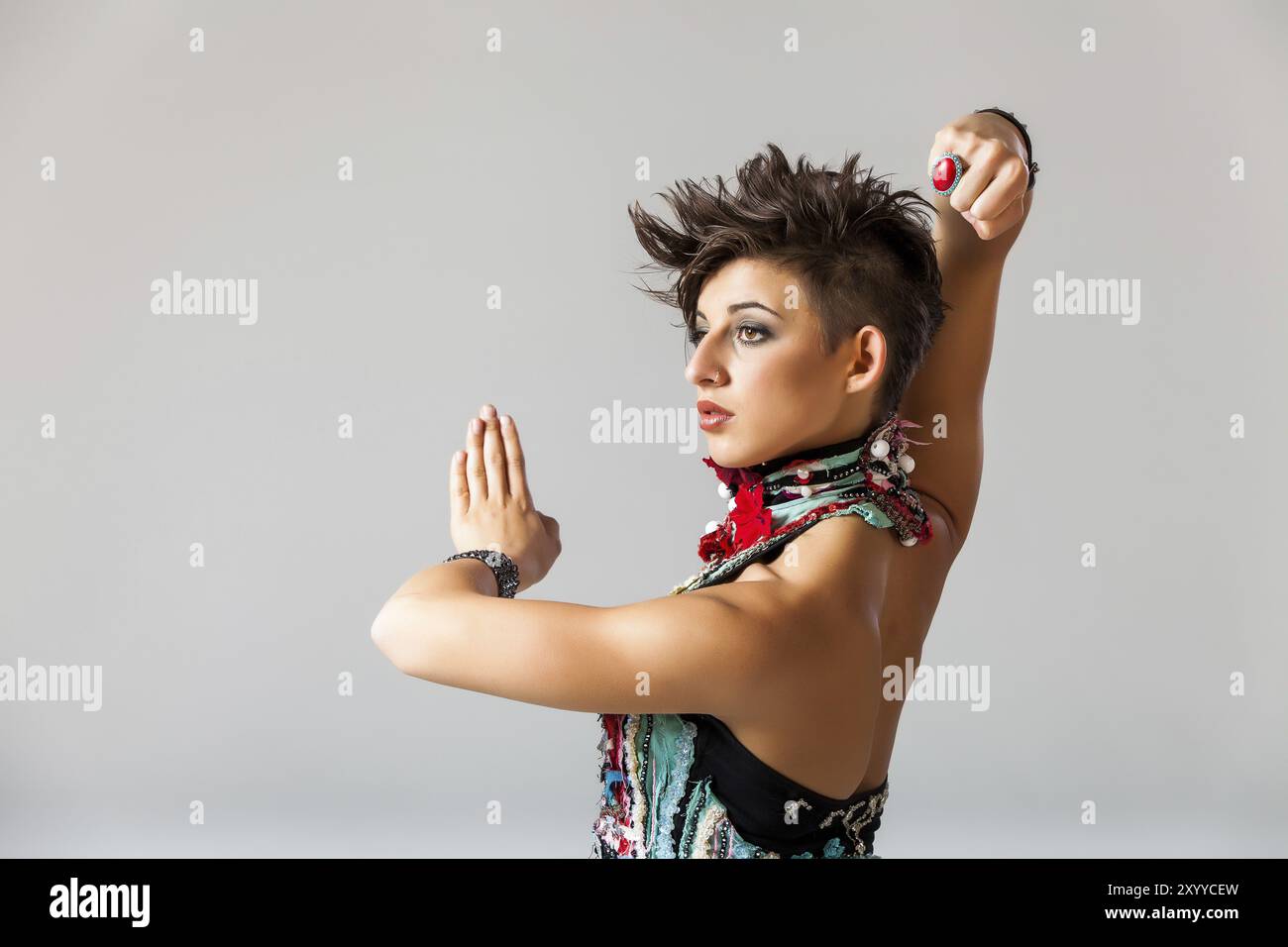 Pretty brunette woman with a punk hairstyle and attitude Stock Photo ...
