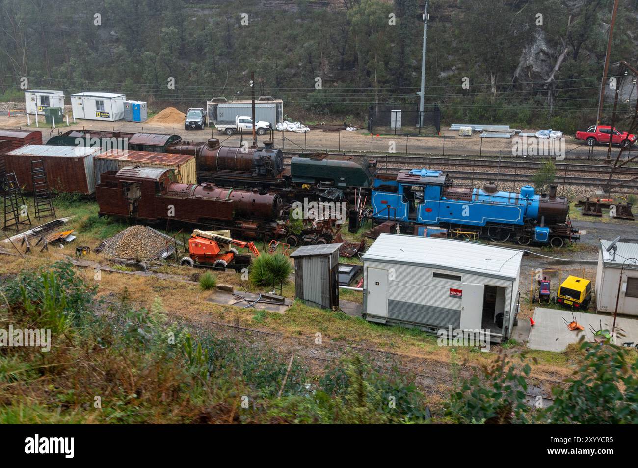 A small marshalling yard filled with vintage locomotives and rolling ...