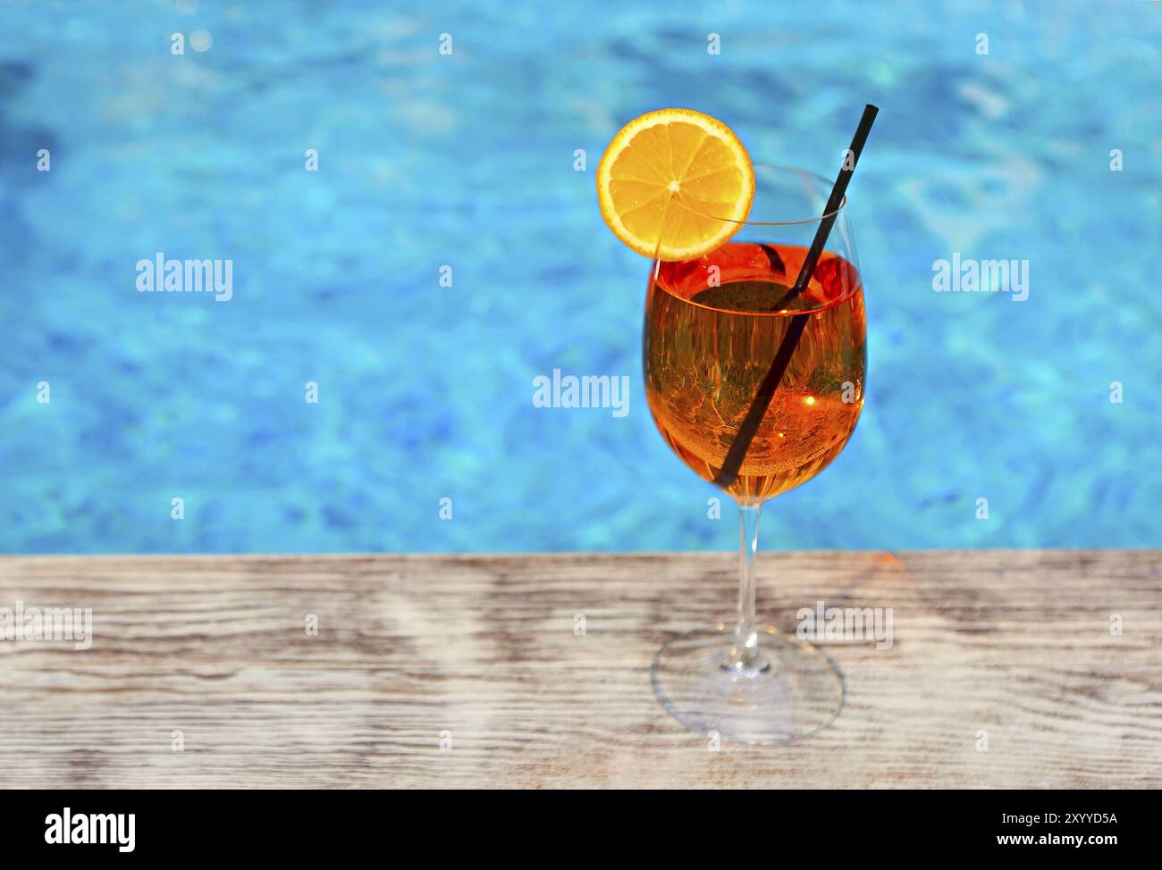 Glass of Aperol Spritz cocktail on the pool nosing at the tropical ...