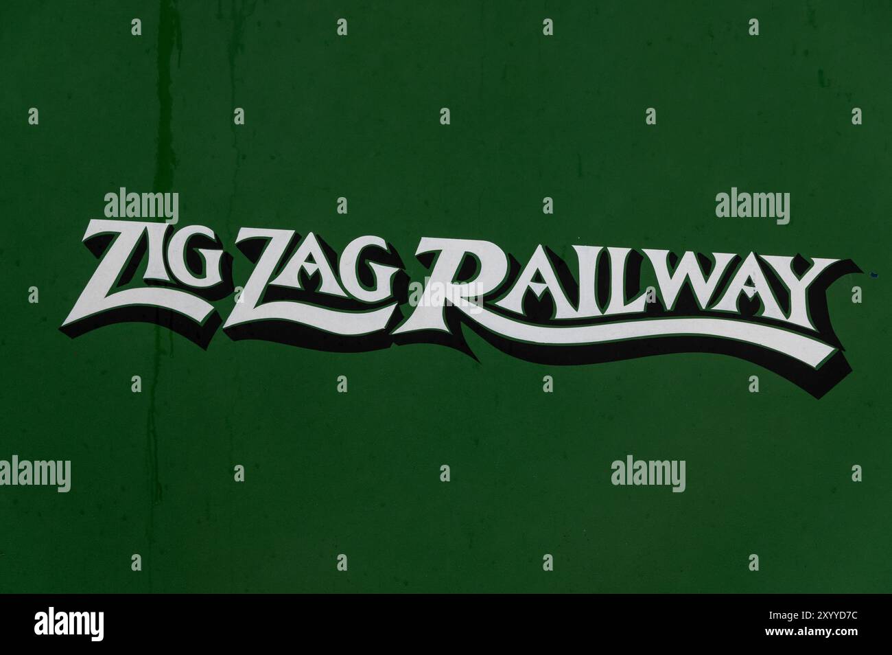 A logo of the of the Zig-zag railway displayed on the water tank of a ...
