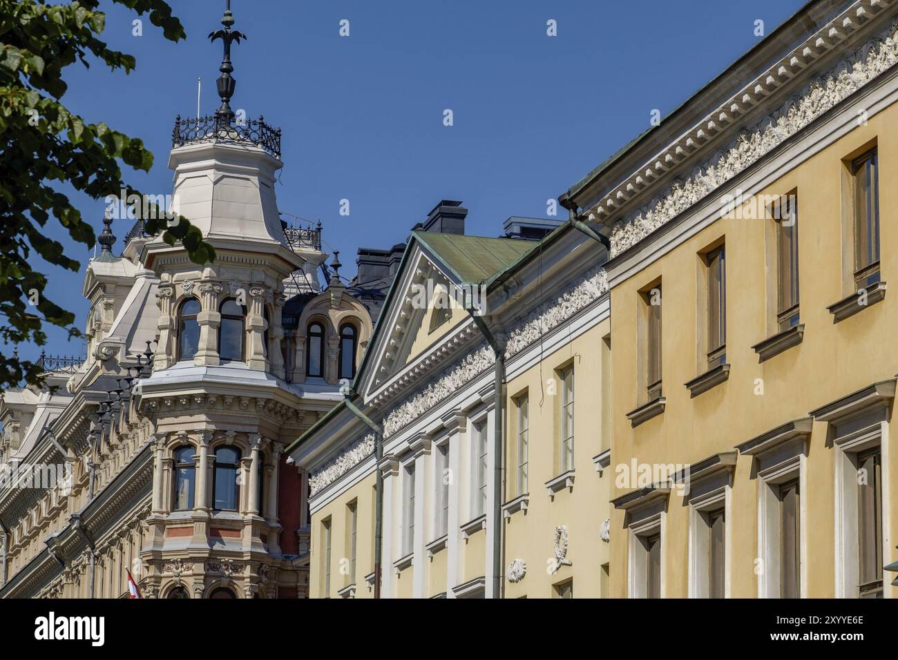 The facades of historic buildings under a clear blue sky in an urban ...