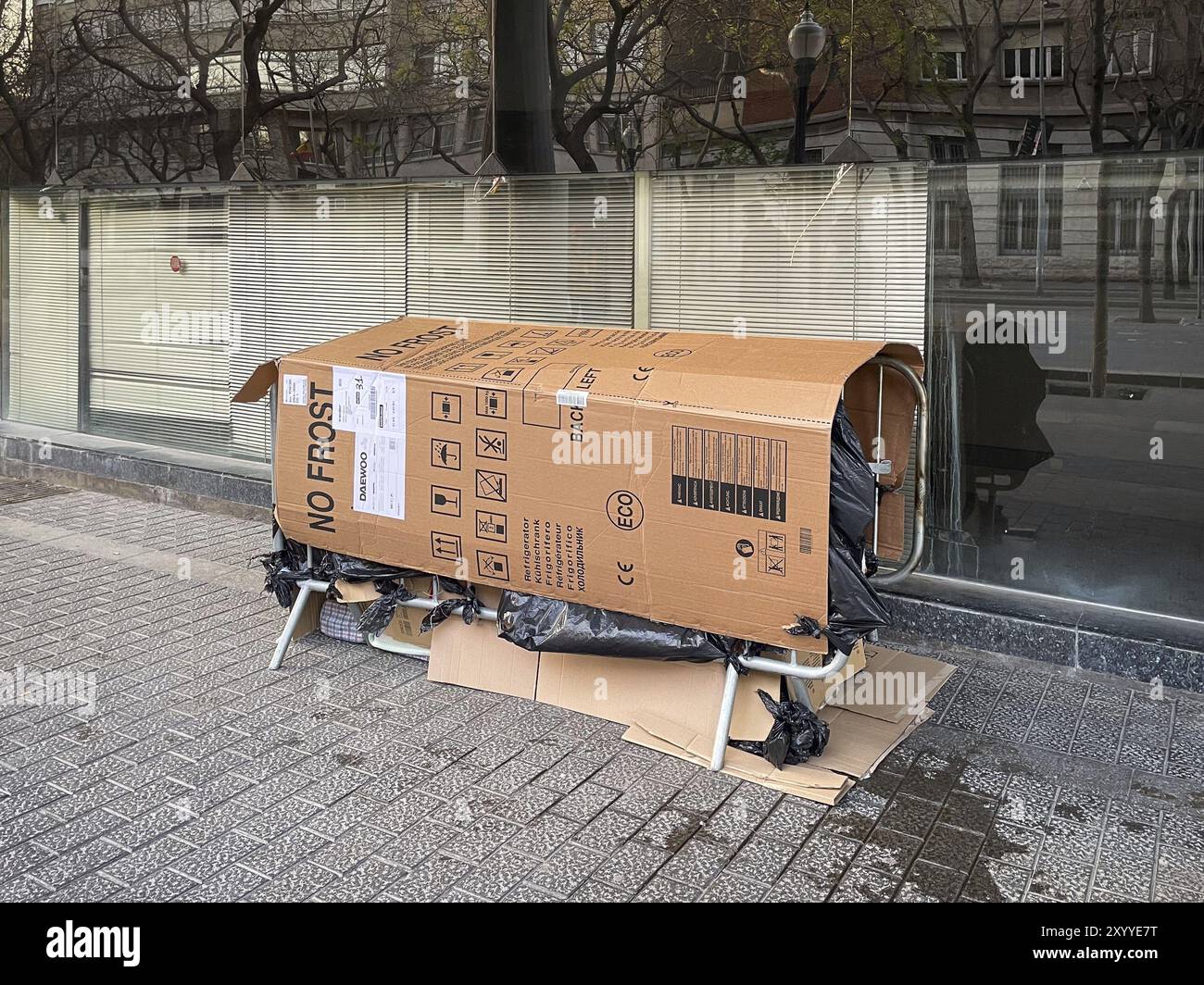 A shelter built with cardboard and barriers for a homeless person in ...