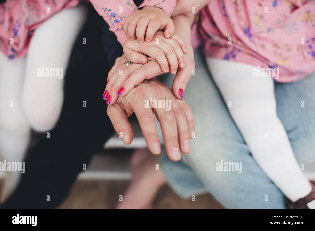 Family hands of four, mother, father and 2 kids Stock Photo - Alamy