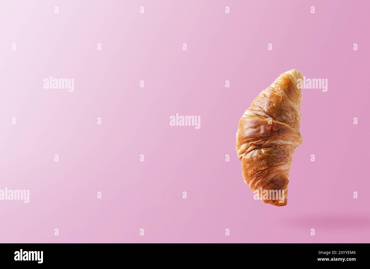 Freshly baked croissant levitating or flying. Croissant fly in the air ...