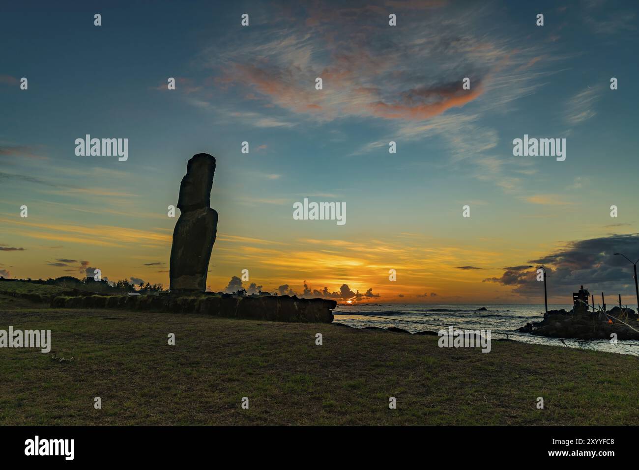 Silhouette of single Moai at Fisherman Port in The Village of Hanga Roa ...
