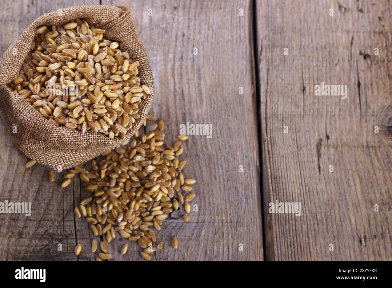 Wheat in small sack hi-res stock photography and images - Alamy