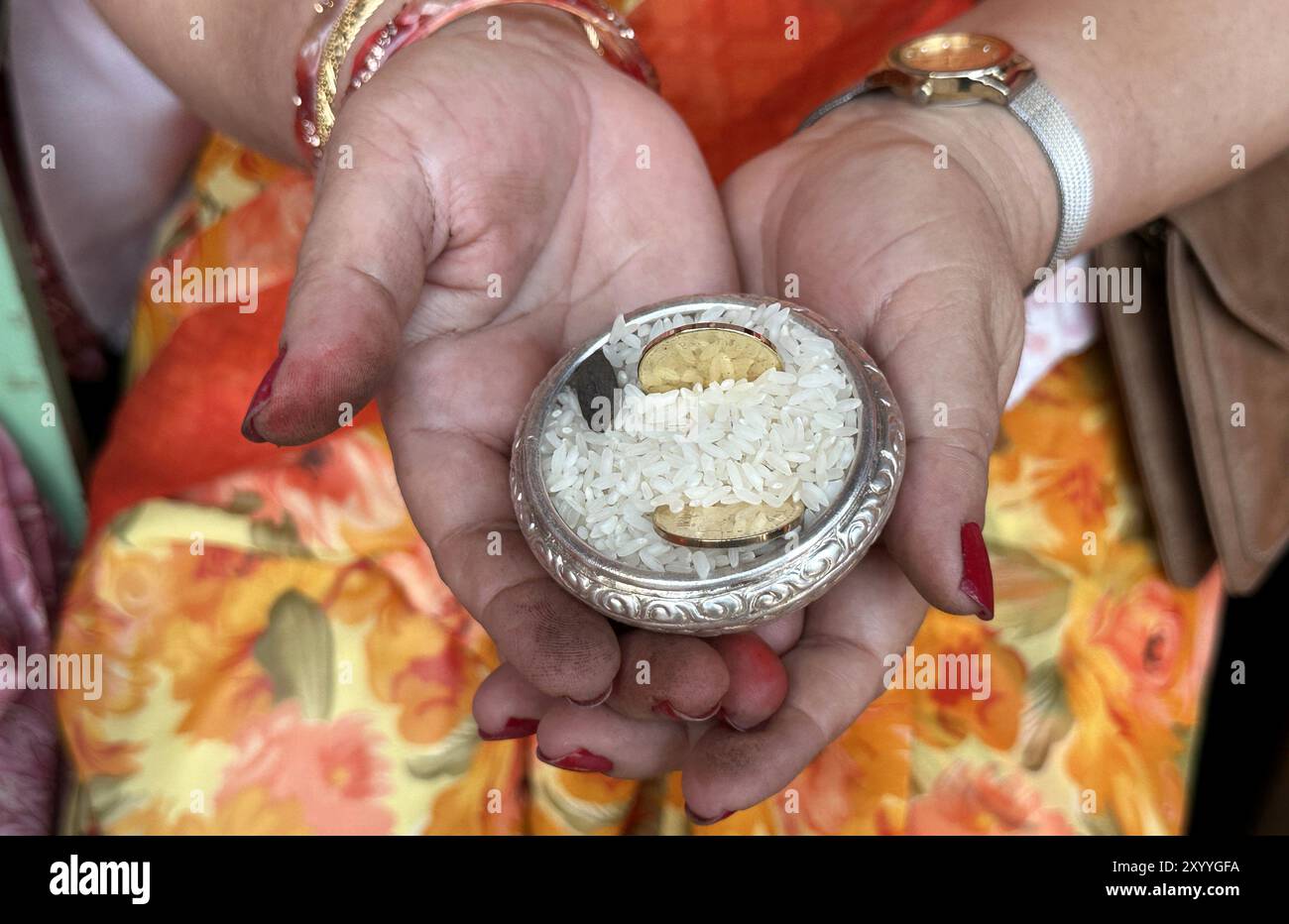 August 31, 2024: A buddhist devotee gets ready to distribute offerings ...