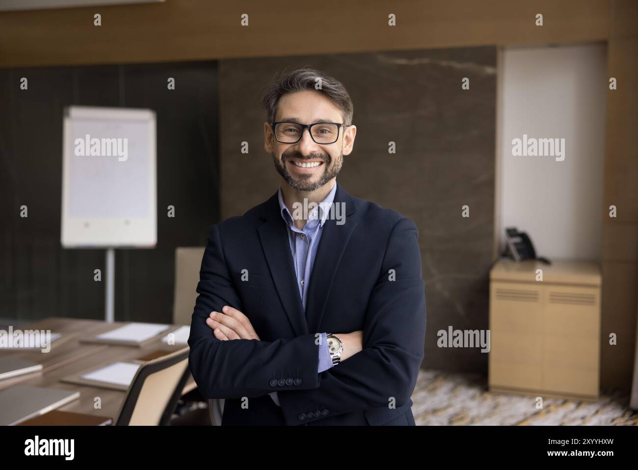 Happy Hispanic company CEO man in eyeglasses looking at camera Stock ...