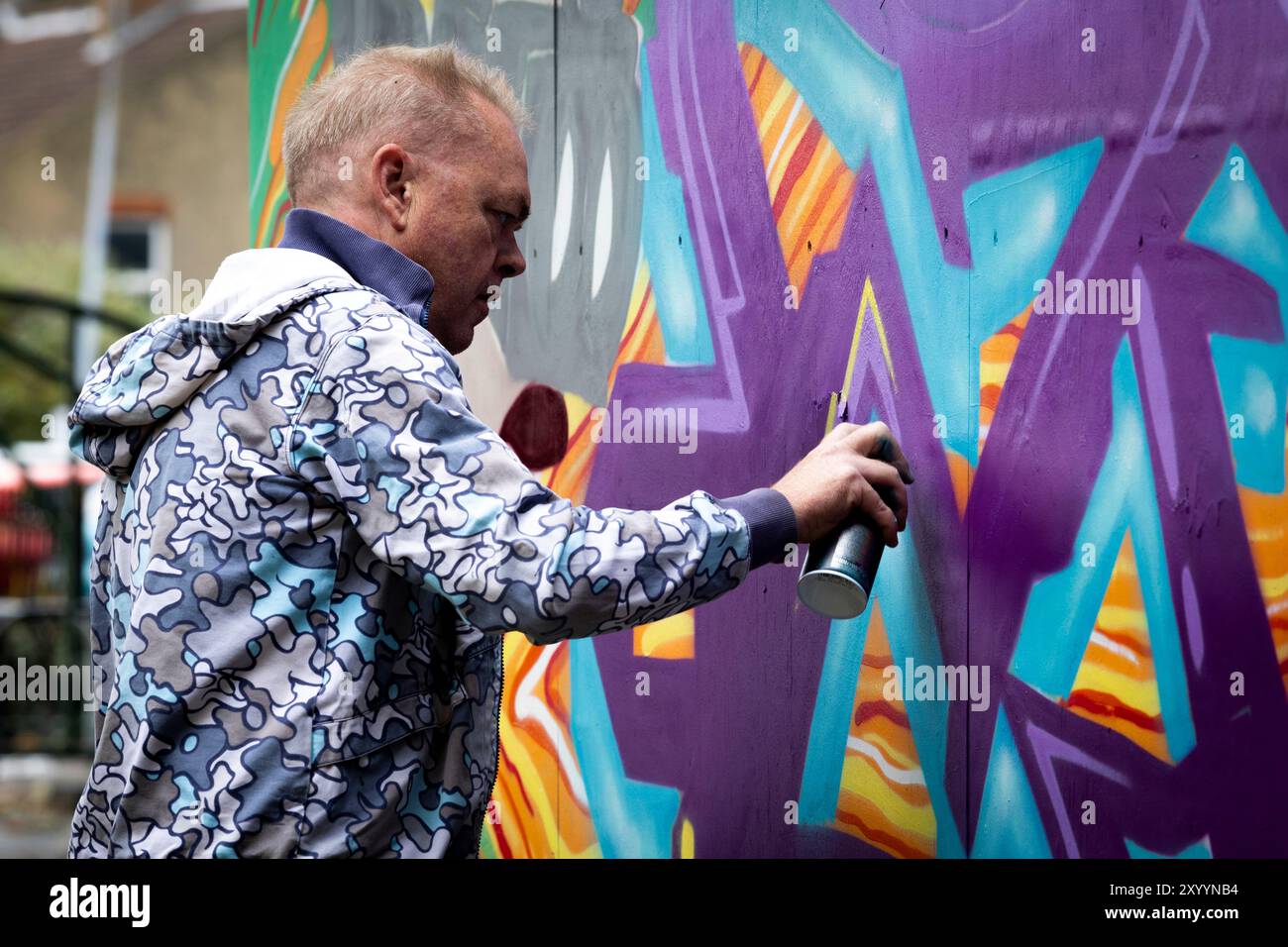 Graffiti artists creating street art pieces at the at the Southend City ...