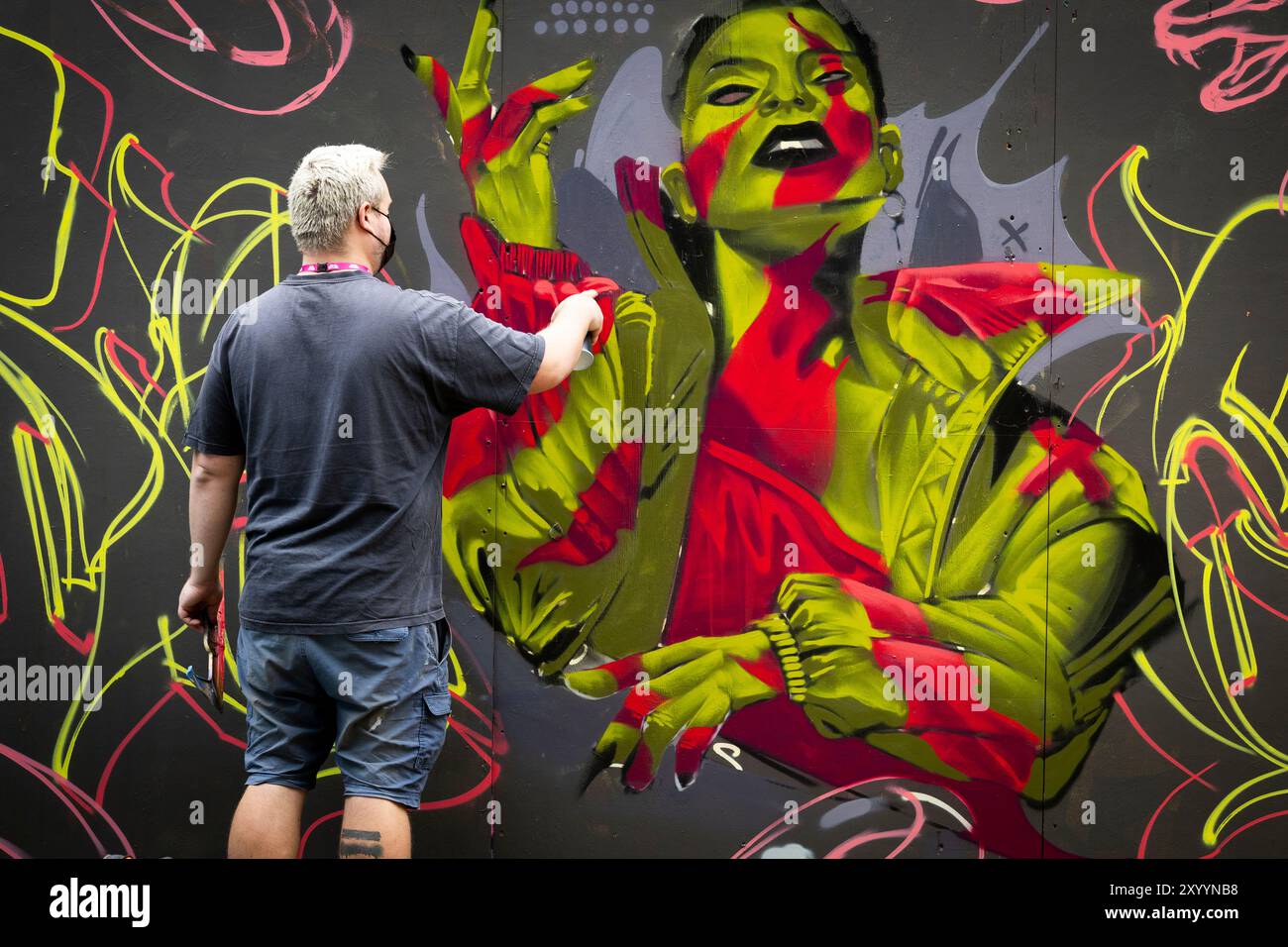 Graffiti artists creating street art pieces at the at the Southend City ...