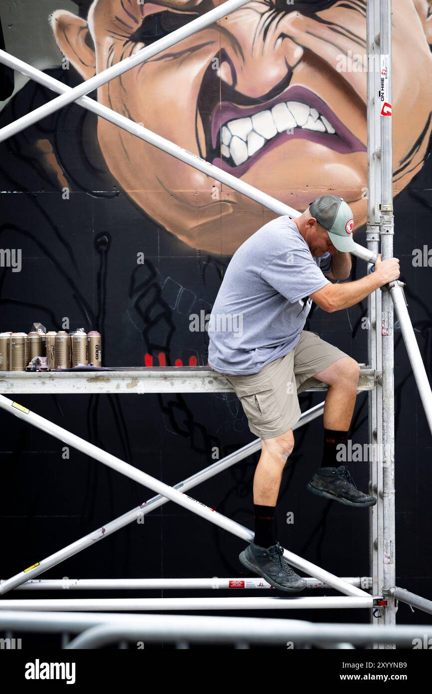 Graffiti artists creating street art pieces at the at the Southend City ...