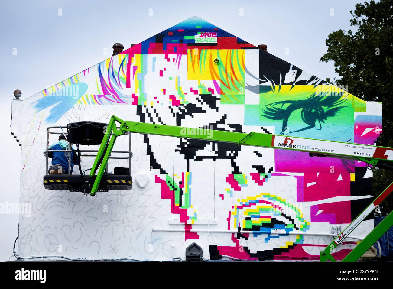 Graffiti artists creating street art pieces at the at the Southend City ...