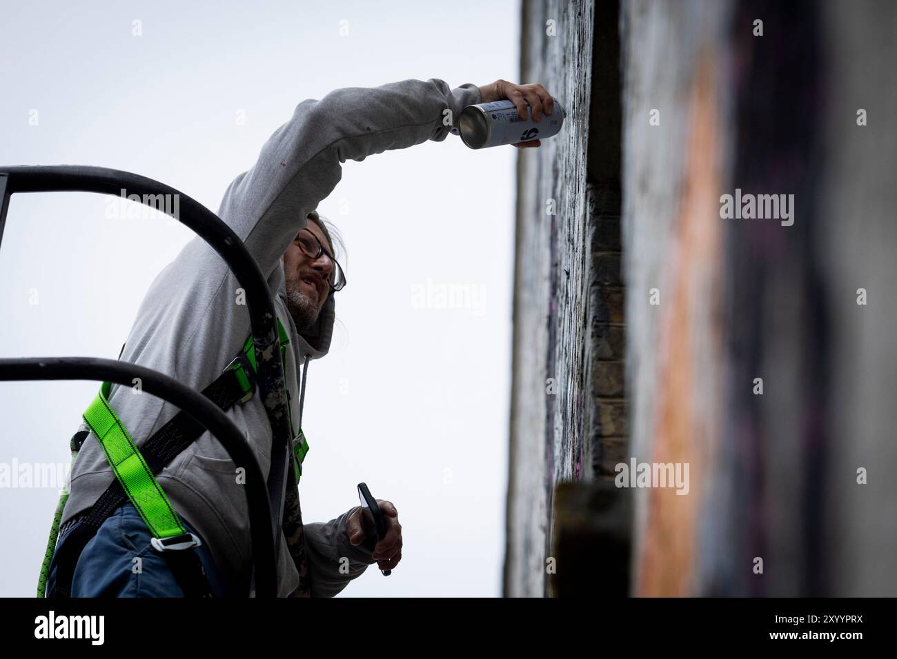 Graffiti artists creating street art pieces at the at the Southend City ...