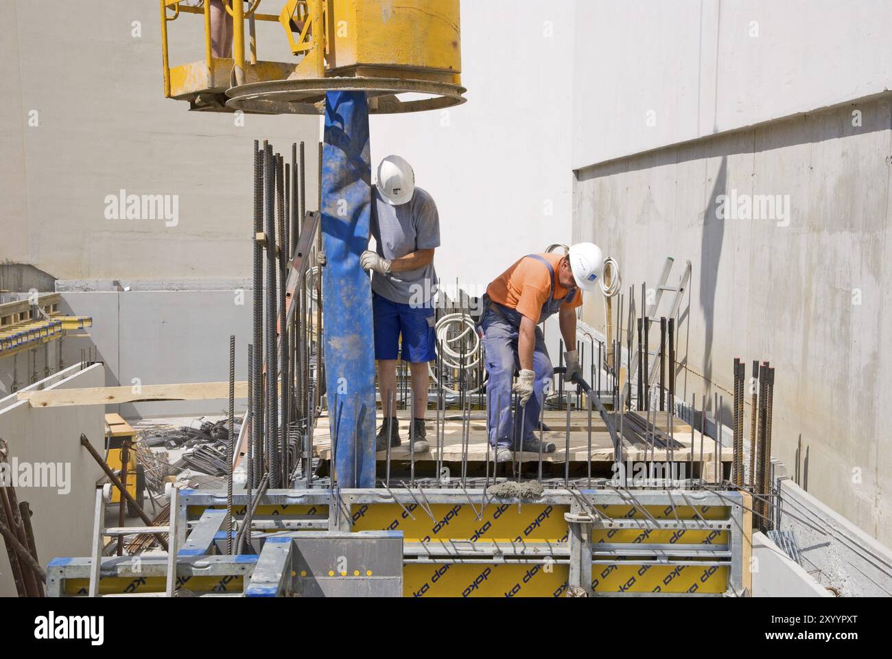 Two construction workers on construction site Stock Photo - Alamy