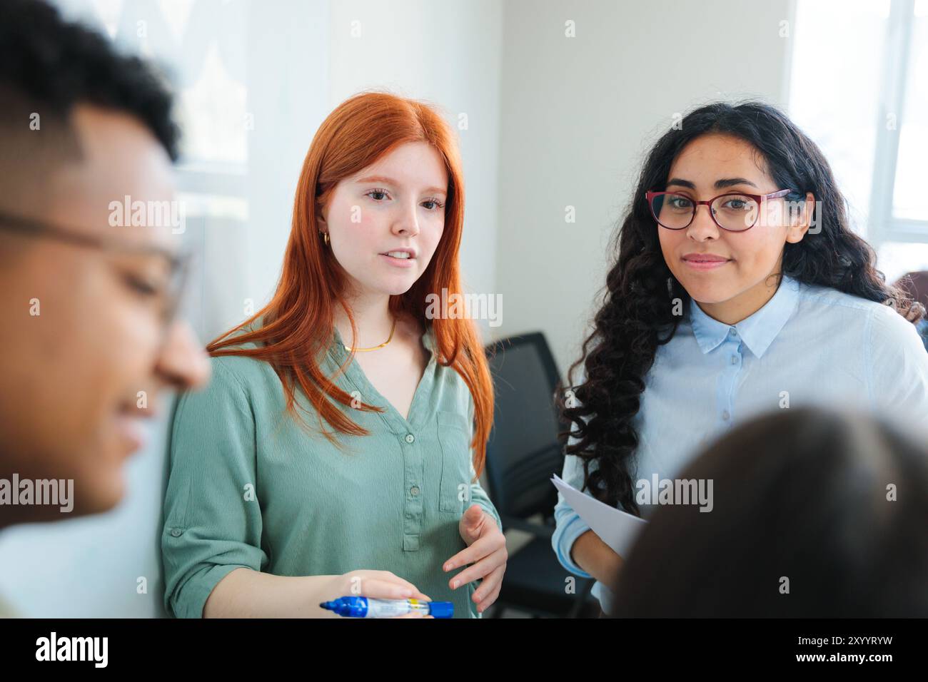 Contemporary co-working space with young professionals or students ...