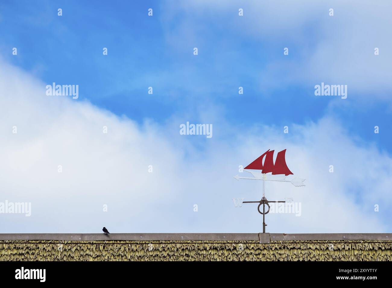 Wind indicator in the shape of a sailing ship on a roof Stock Photo - Alamy