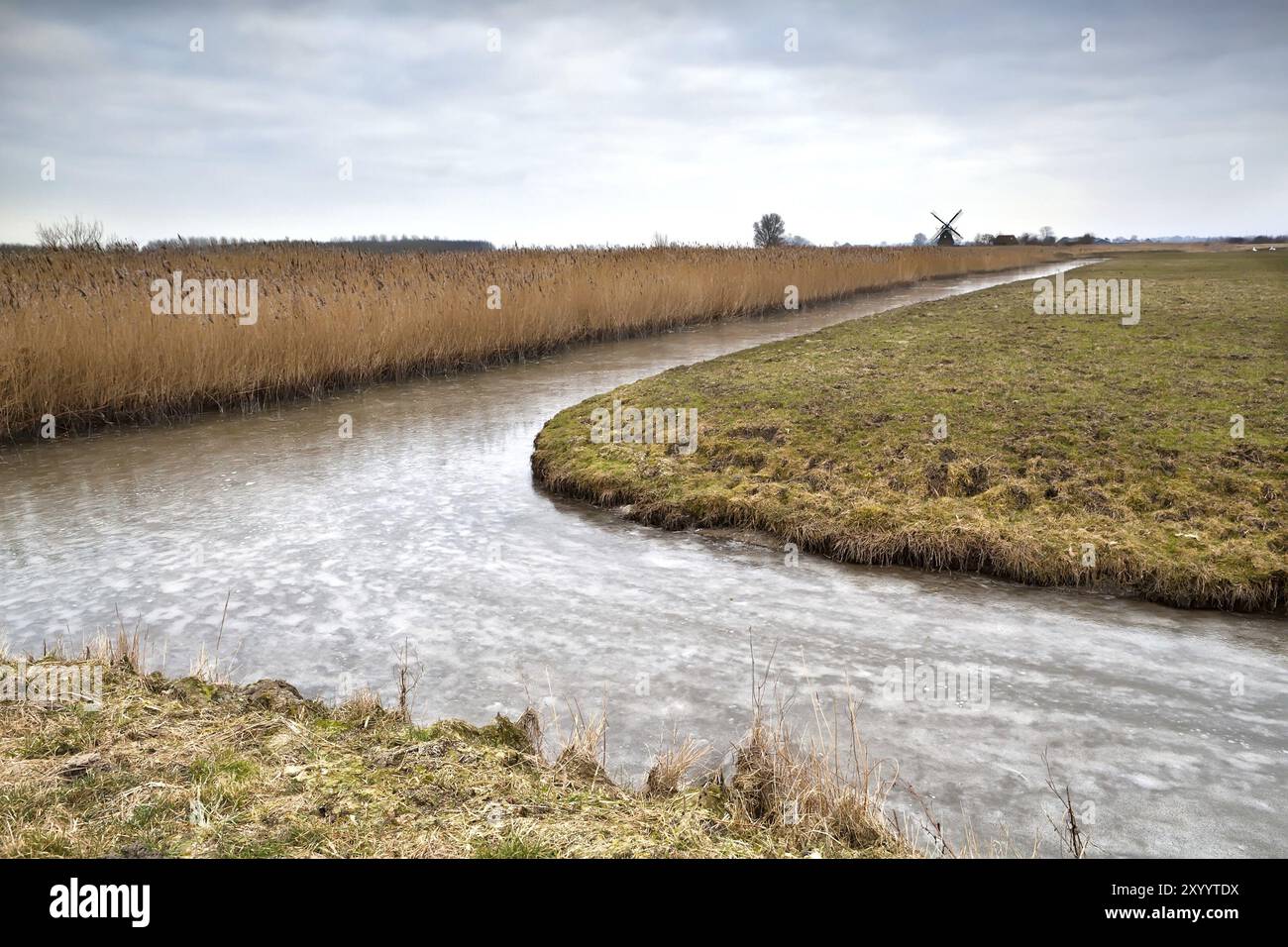Dutch windmill over river waters hi-res stock photography and images ...