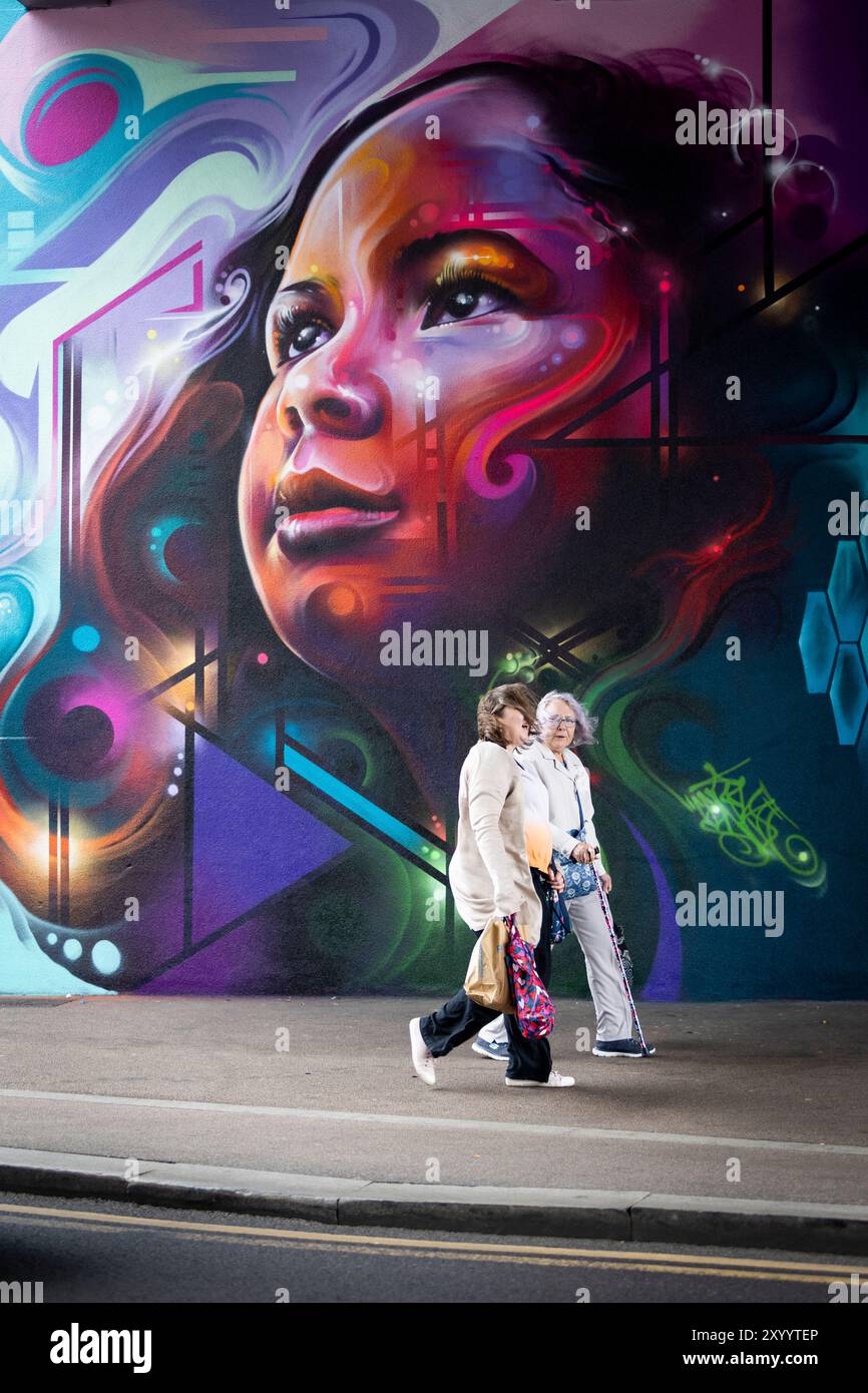 Graffiti artists creating street art pieces at the at the Southend City ...