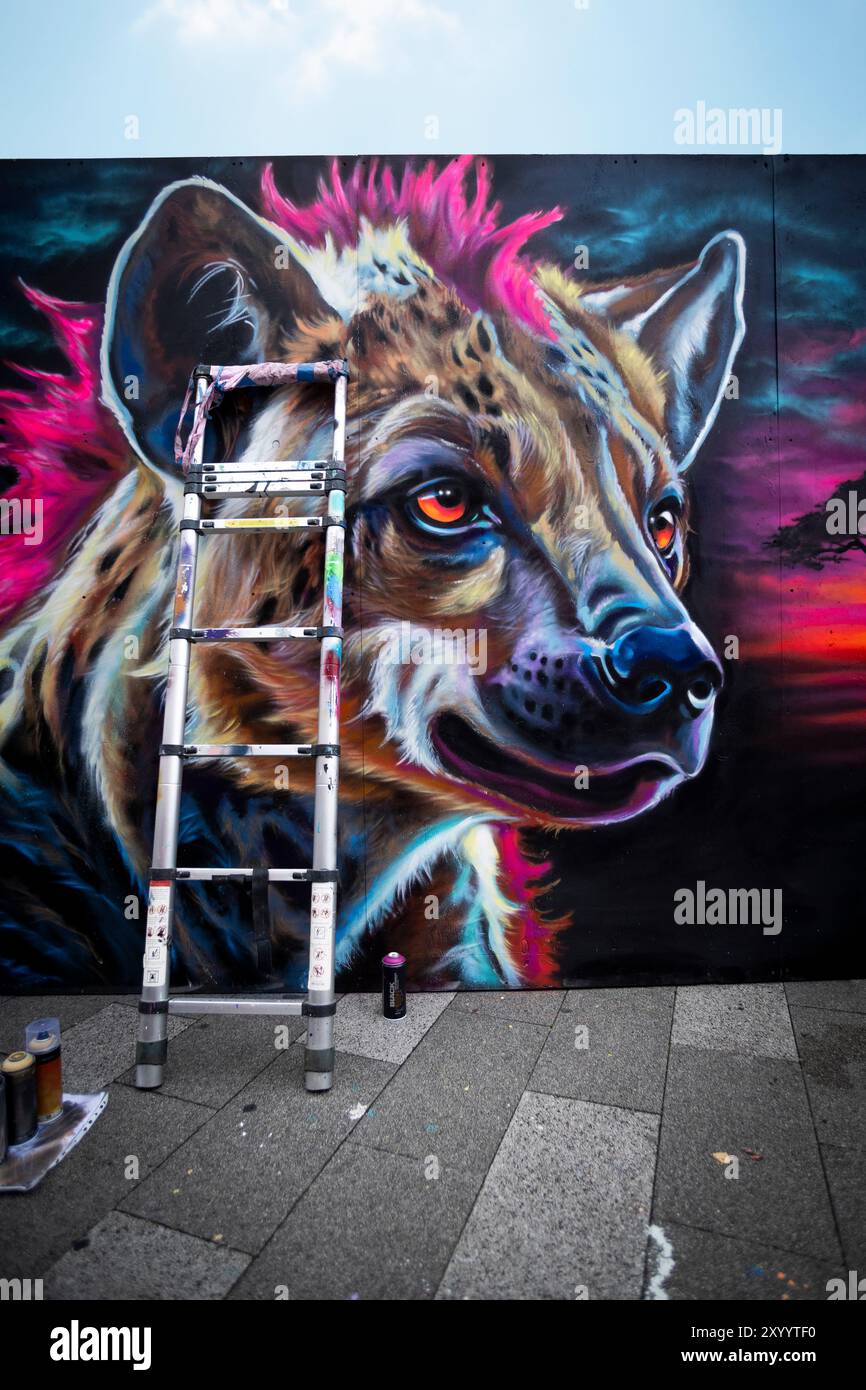 Graffiti artists creating street art pieces at the at the Southend City ...