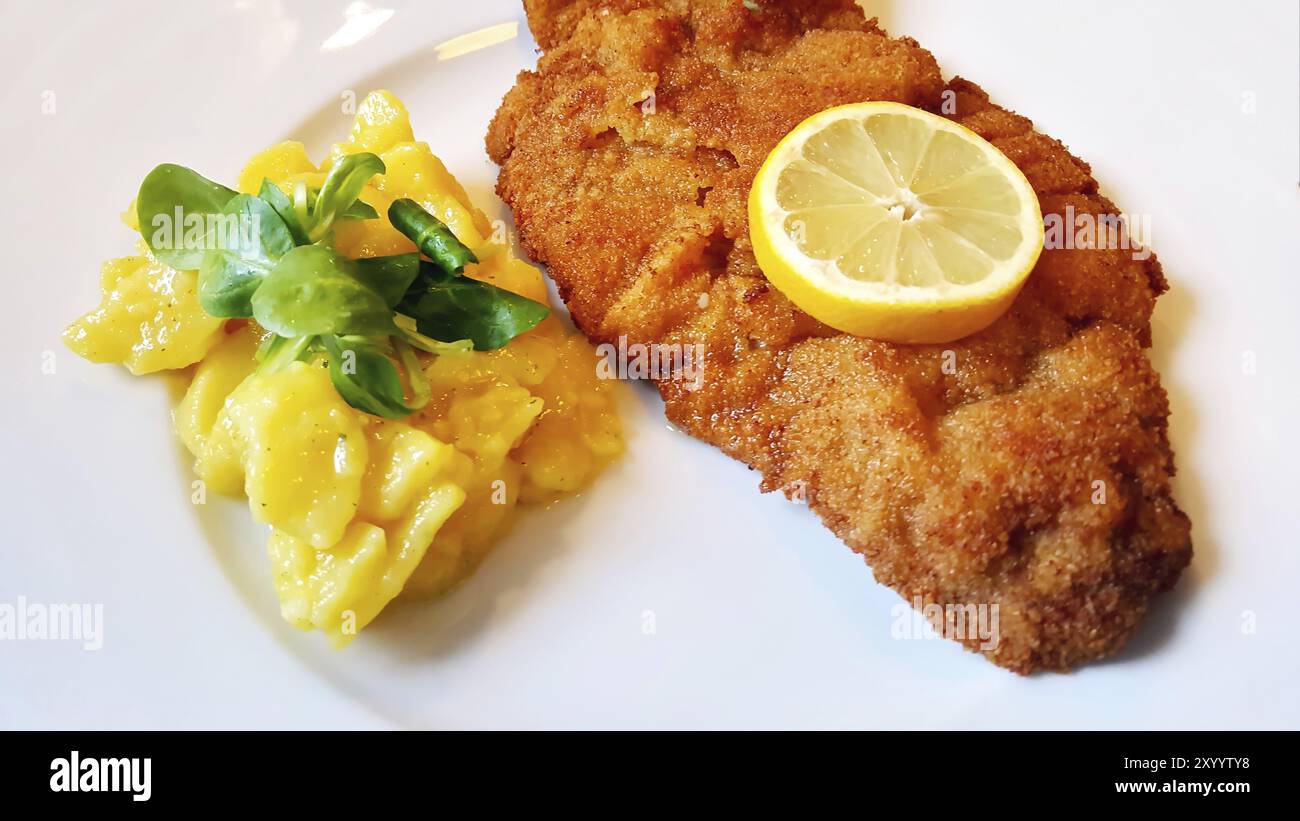 Wiener schnitzel with potato salad Stock Photo - Alamy