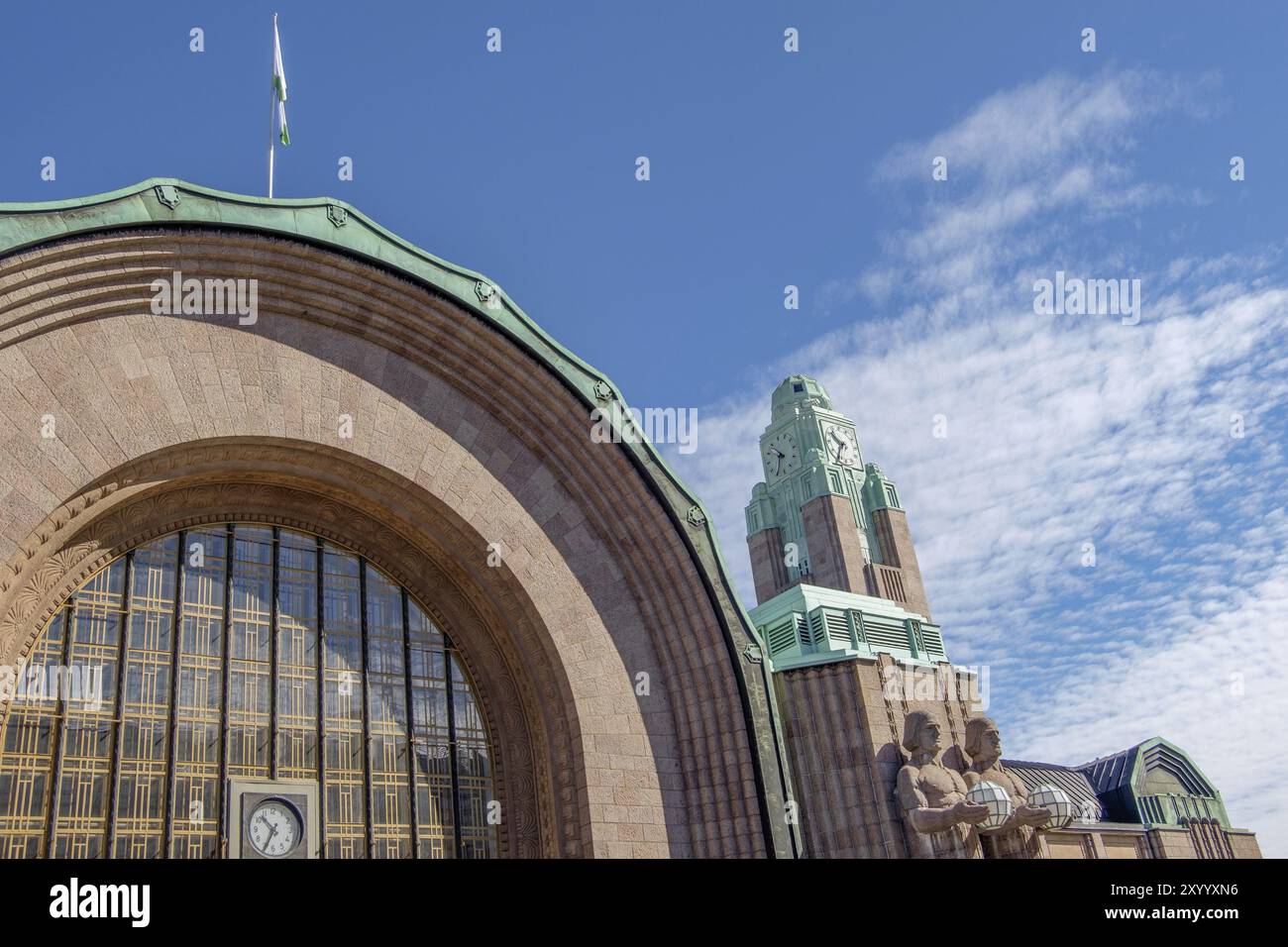 Historic building entrance with ornate decorations and a clock tower ...