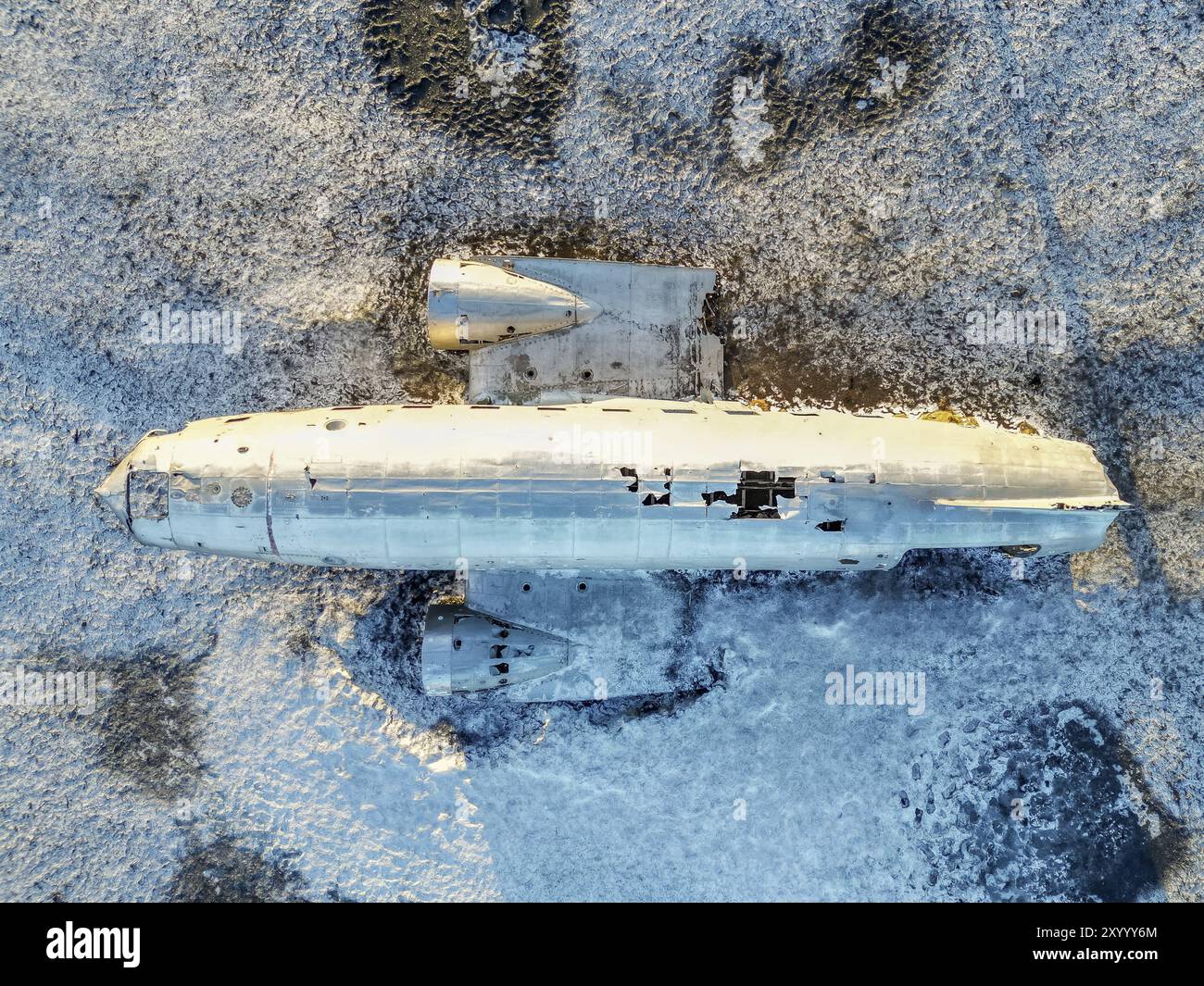 Aerial drone view of crashed plane on frozen Solheimasandur beach in ...