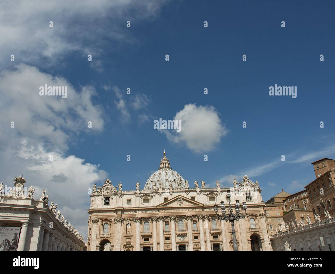 Historic basilica with baroque architecture and a cloud in the blue sky ...