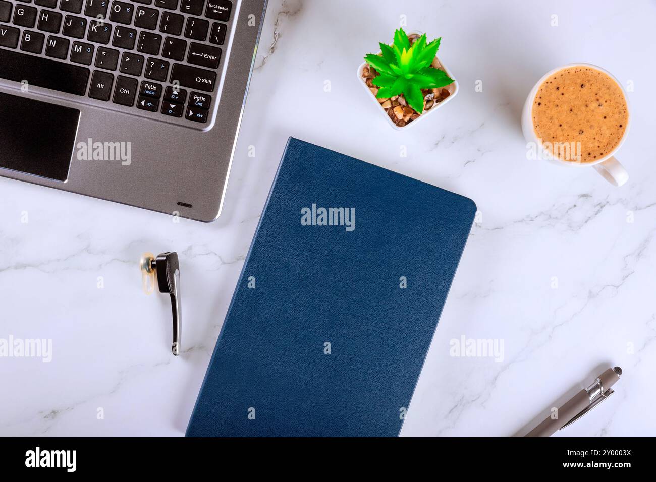 Providing workspace with desk, laptop coffee pot pen, notebook Stock ...