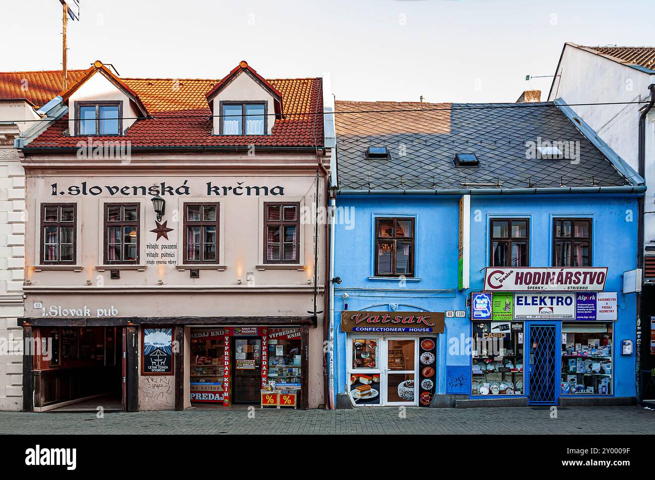 two typical Slovakian buildings with intense colors with shops Stock ...