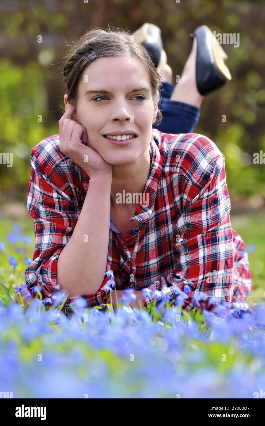 Beautiful young woman lying in hi-res stock photography and images - Alamy