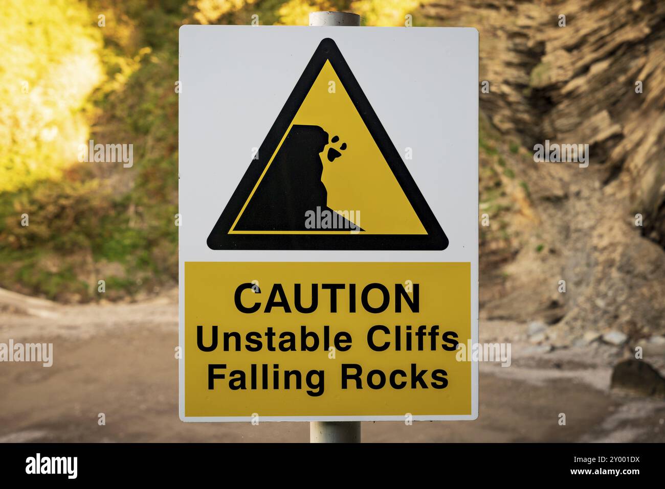 Sign: Caution, unstable cliffs falling rocks, seen in Ilfracombe, Devon ...