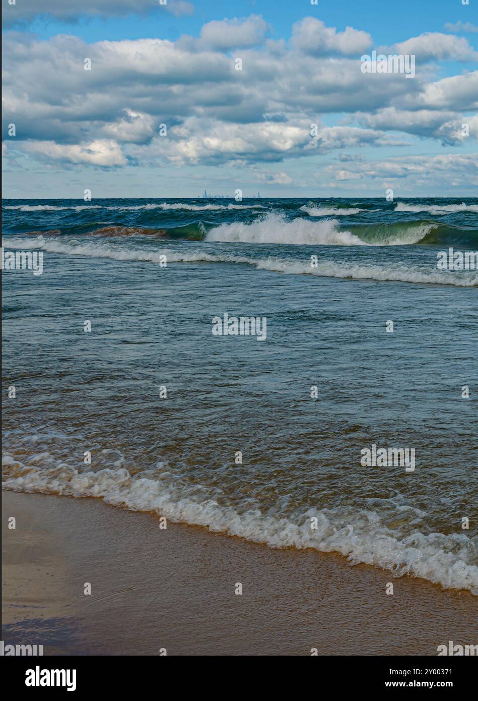 Large three to five foot waves roll in to the Indiana shore while the ...